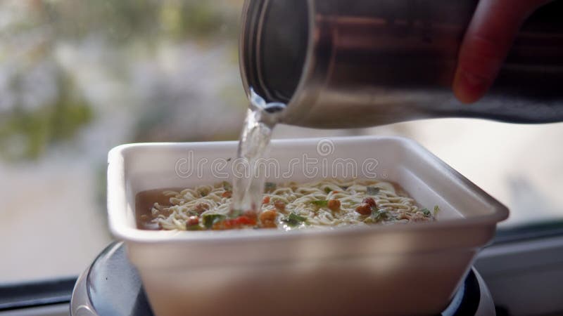 Adding Boiling Water To the Top Ramen. Brewing Instant Noodles Stock ...