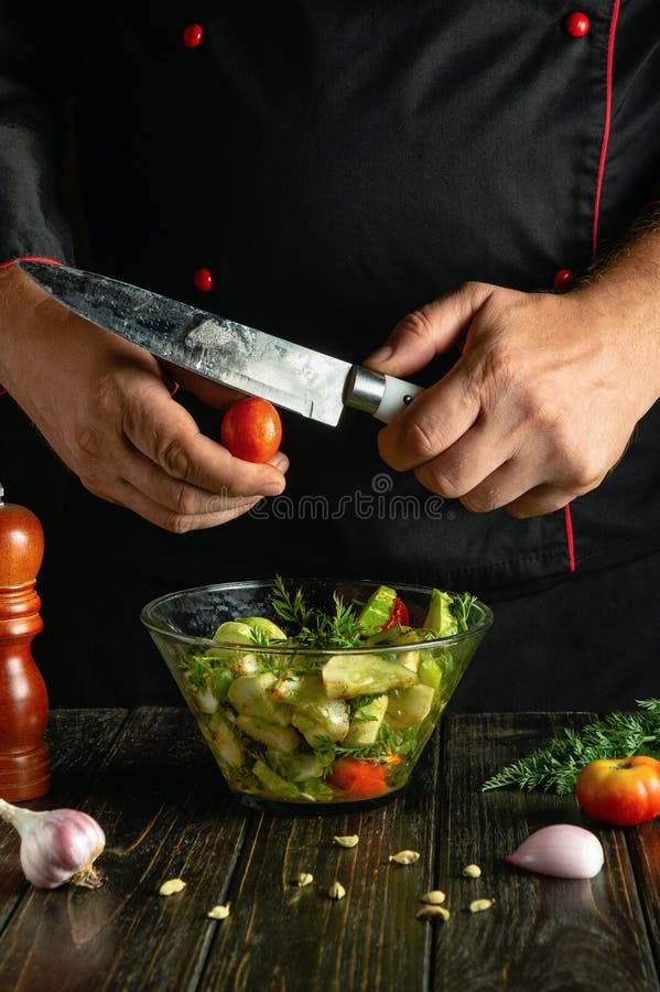 Adding Chopped Tomatoes To a Fresh Vegetable Salad. Kitchen Work ...