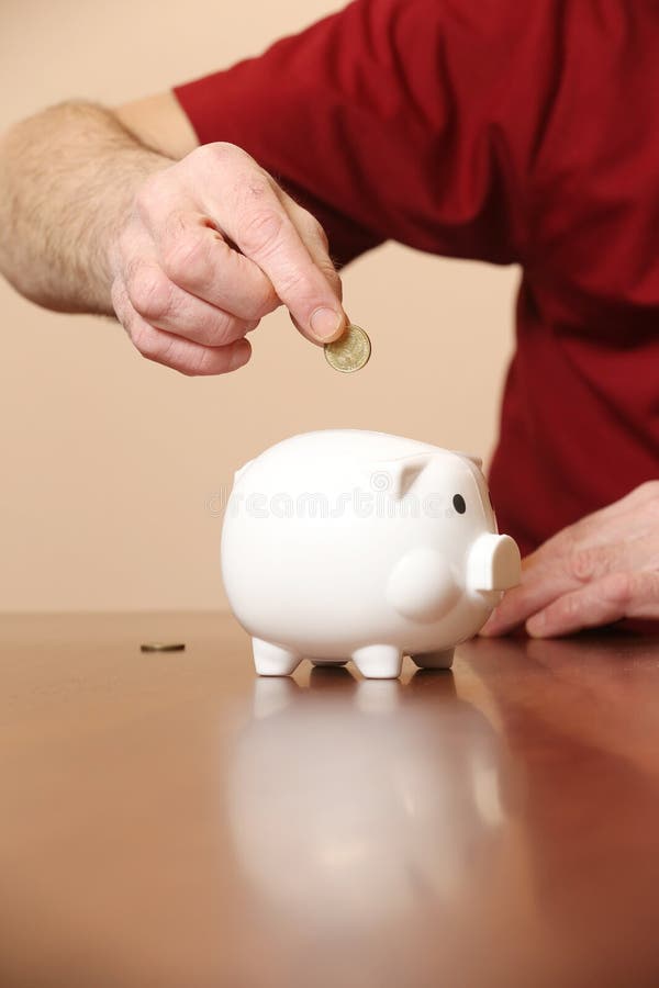 Adding coin in piggy bank stock image. Image of banking - 63977497