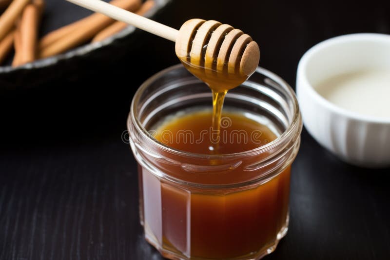 Adding a Dot of Honey into Chai from a Silver Spoon Stock Photo - Image ...