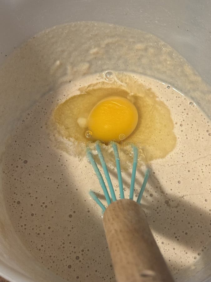 Adding an Egg To the Pancake Batter Stock Photo - Image of adding ...