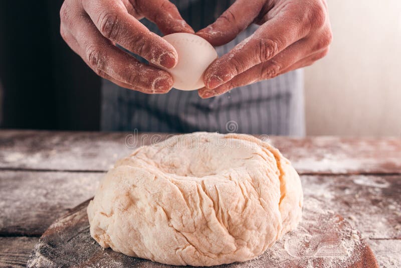 Adding Egg into Raw Dough Close-up Stock Photo - Image of roll, baker ...