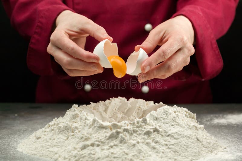 Adding Egg To a Pile of Flour Stock Image - Image of flour, eggs: 275096485
