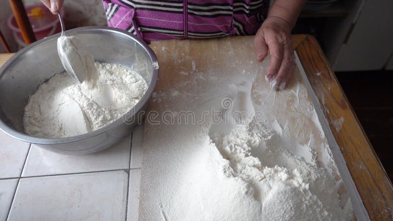 Adding Flour To the Base for the Dough in a Metal Bowl Stock Photo ...