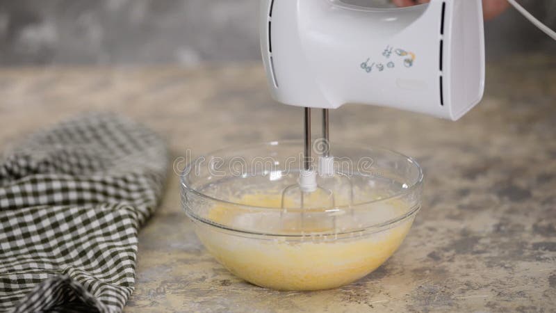 Adding Flour To Batter in Glass Bowl. Mixing Cake Batter with Mixer ...