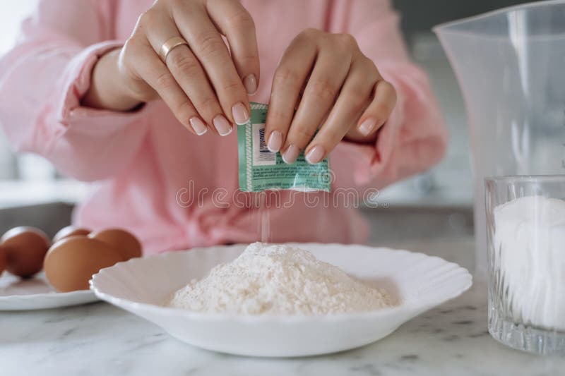 Adding Ingredients To Flour for Baking Preparation Stock Image - Image ...