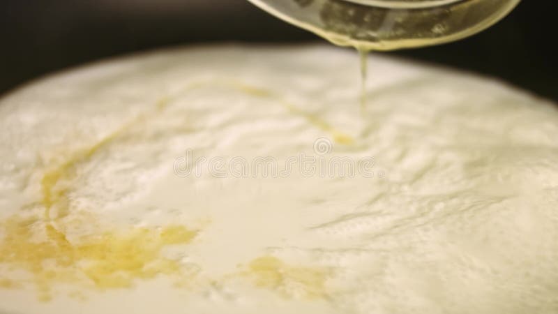 Adding Melted Chicken Fat To Mixed Milk and Water Boiling in a Frying ...