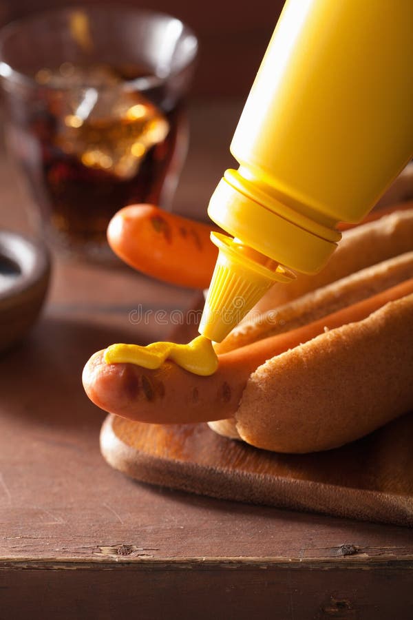 Adding Mustard To Grilled Hot Dog Stock Photo - Image of colorful ...