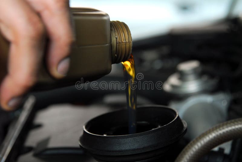 Adding Oil to a Car stock image. Image of industry, emergency - 62864723