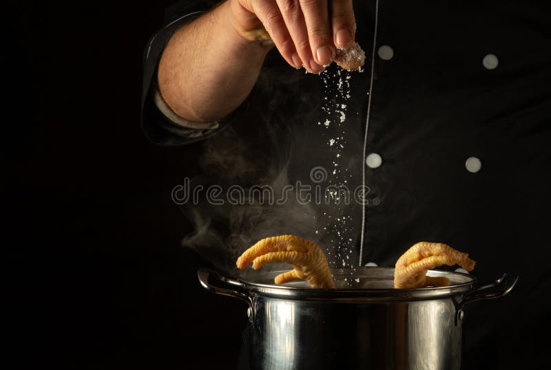 Adding Salt with the Chef Hands To a Pot of Boiling Chicken Legs ...