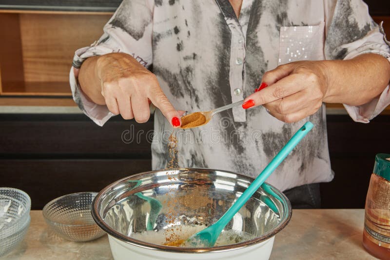 Adding Spices To Baking Mixture Stock Photo - Image of food ...