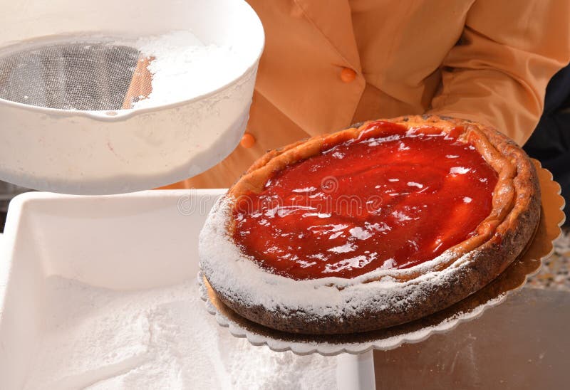 Adding sugar on a cake stock photo. Image of baker, indulgence - 54146446