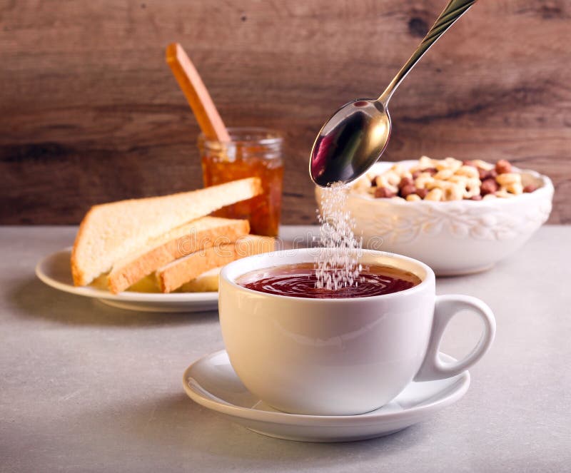 Adding Sugar into Tea in a Cup Stock Photo - Image of breakfast, diet ...
