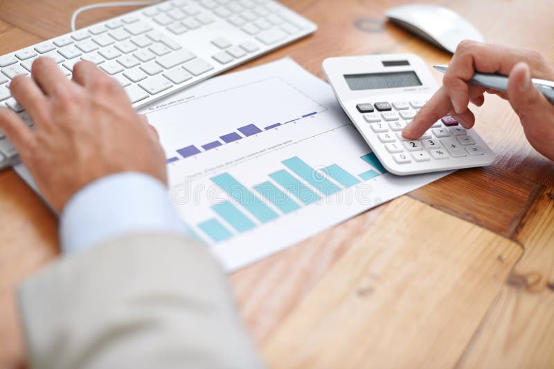 Adding Up the Numbers. Cropped Shot of a Businessman Using a Calculator ...