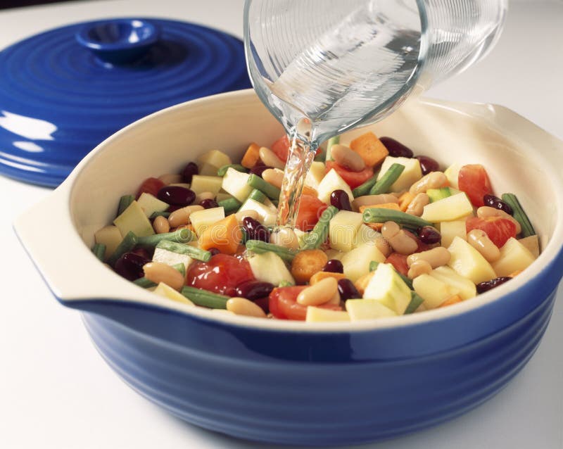 Adding the water and boil stock image. Image of tomato - 23704309