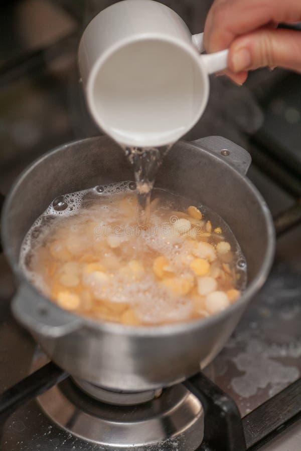 Adding Water To Boiling Pea Flakes Porridge Stock Image - Image of food ...