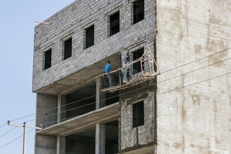 Construction Workers on a Hanging Scaffold Editorial Photo - Image of ...