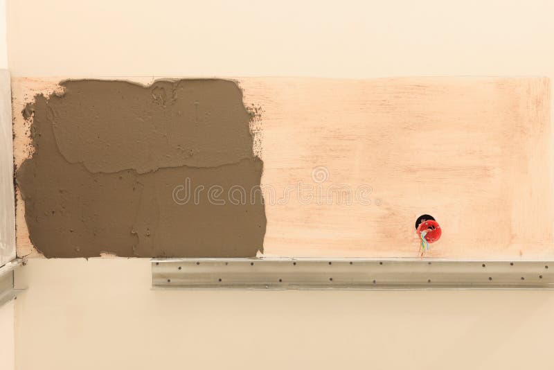 Adhesive Mix for Installing Tile on Wall Stock Photo - Image of ...