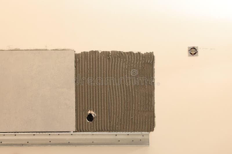 Adhesive Mix with Tile on Wall, Closeup Stock Photo - Image of laying ...