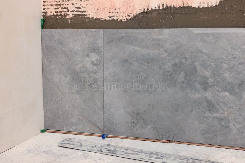 Adhesive Mix and Tiles on Wall Indoors Stock Photo - Image of adhesive ...