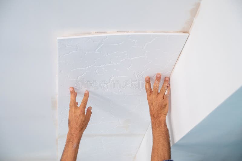 Adhesive Plaster Application of Styrofoam Ceiling Tiles of a Home ...