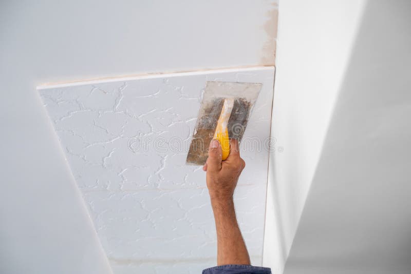 Adhesive Plaster Application of Styrofoam Ceiling Tiles of a Home ...