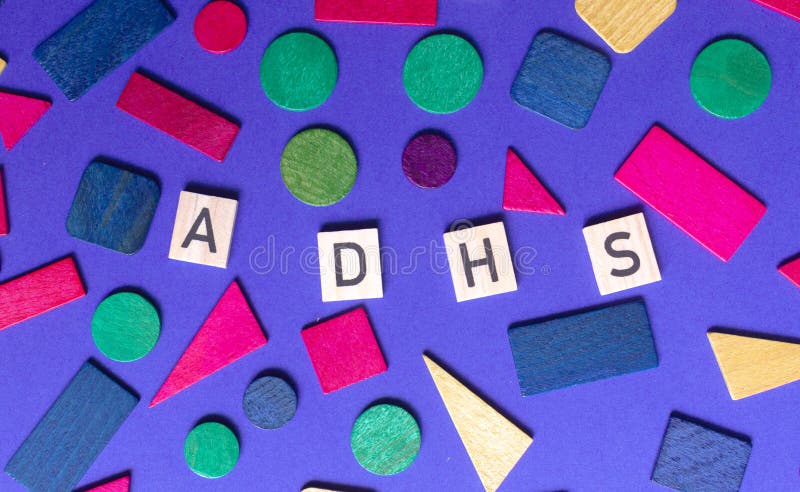 ADHS on Wooden Block and Chaotic Blue Background with Shapes, ADHS in ...