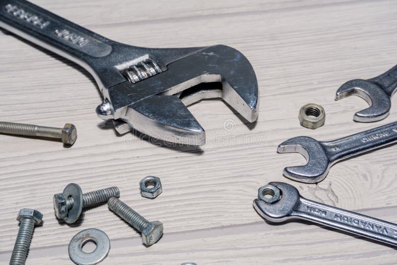 Adjustable and Ordinary Spanners, Nuts and Bolts on the Table Stock ...
