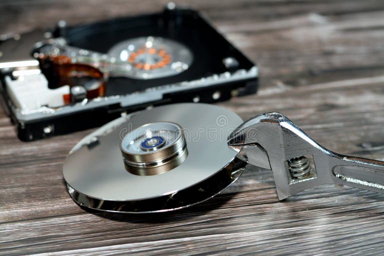 An Adjustable Spanner Wrench and HDD Platters Together, Hard Disk Drive ...