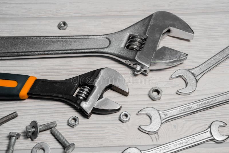 Adjustable Spanners and Wrenches, Nuts and Bolts on the Table Stock ...