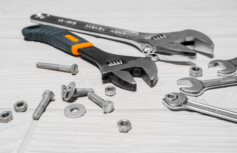 Adjustable Spanners and Wrenches, Nuts and Bolts on the Table Stock ...