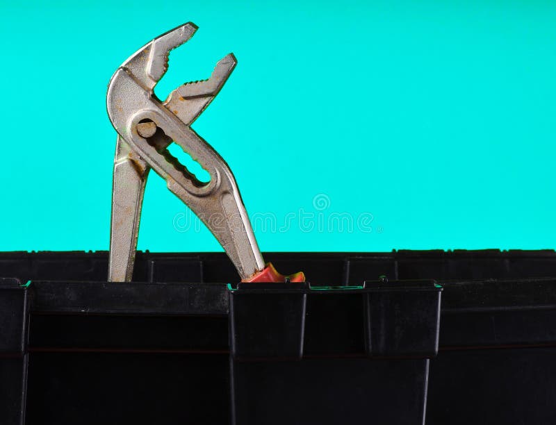 Adjustable Wrench in Black Plastic Tool Box Isolated Blue Stock Photo ...