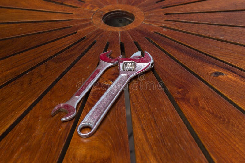 Adjustable Wrench on Wooden Table Stock Image - Image of door, table ...