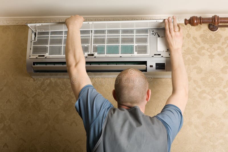Adjuster Sets a New Air Conditioner Stock Image - Image of installer ...