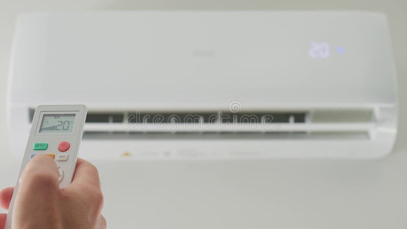 Adjusting Air Conditioner Temperature with Remote Control Stock Footage ...