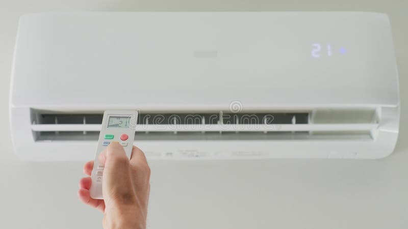 Adjusting Air Conditioner Temperature with Remote Control Stock Video ...