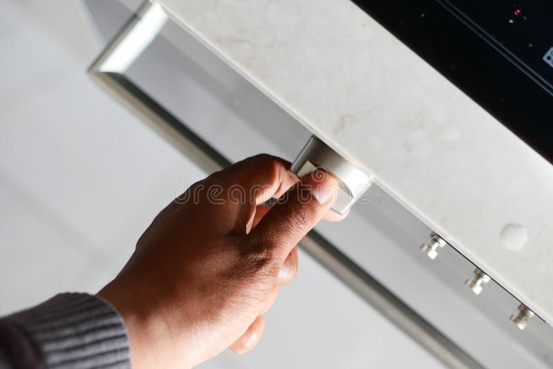 Adjusting the Dial on Modern Kitchen Appliance Control Stock Photo ...