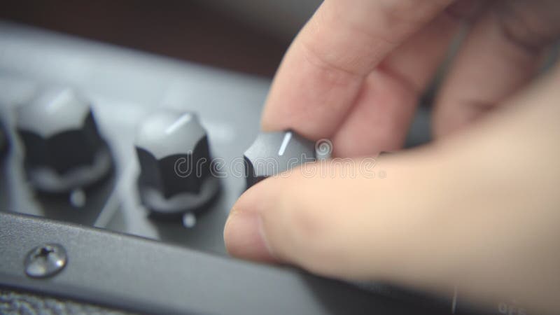 Adjusting Equalizer Knobs of a Guitar Amplifier Stock Footage - Video ...