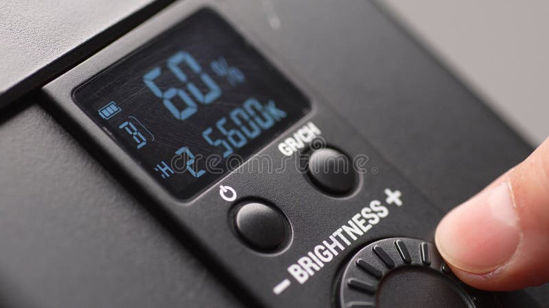Adjusting Light Intensity on Digital Control Panel. Stock Image - Image ...