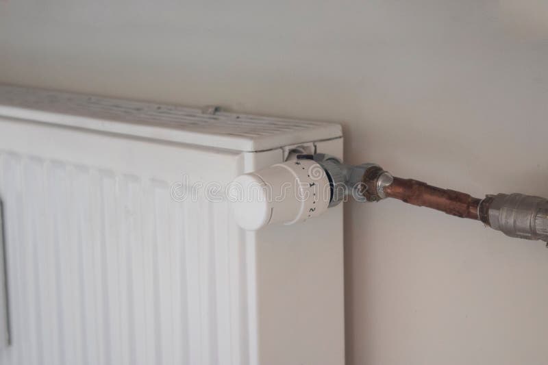 Adjusting the Radiator Temperature Using a Thermostat in an Apartment ...