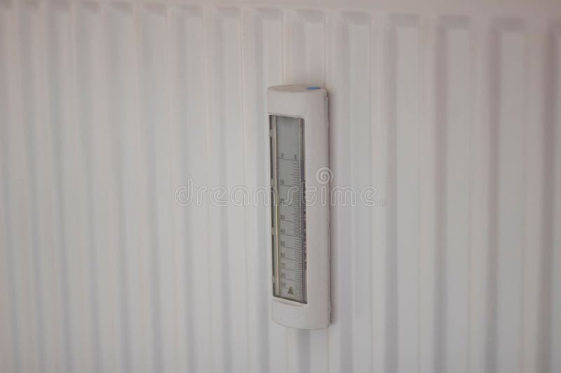 Adjusting the Radiator Temperature Using a Thermostat in an Apartment ...