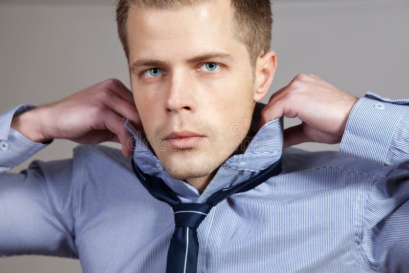 Adjusting shirt and tie stock image. Image of fashionable - 24286323