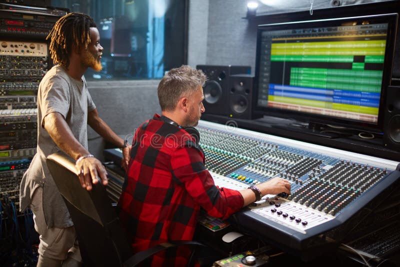 Adjusting sound level stock image. Image of working, studio - 77604399