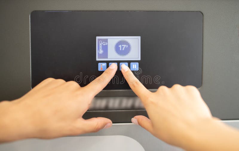 Adjusting Temperature Settings on a Modern Appliance Display in a ...