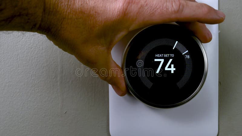 Adjusting Temperature on a Smart Thermostat for Home Stock Footage ...