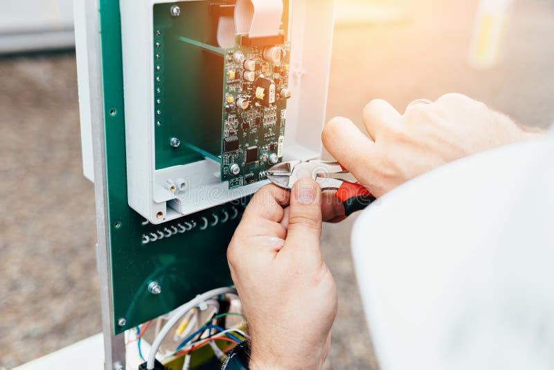 Adjustment of Control and Measuring Equipment. the Hands of an ...