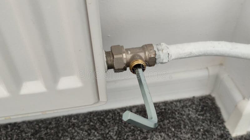 Adjustment Key is Inserted into the Heating Radiator Regulator Stock ...