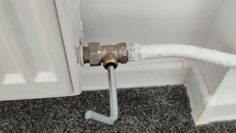 Adjustment Key is Inserted into the Heating Radiator Regulator Stock ...