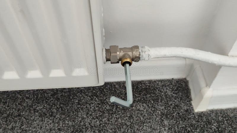 Adjustment Key is Pulled Out of the Heating Radiator Regulator Stock ...