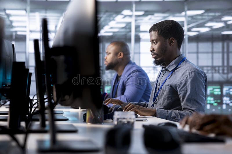 Admin Coworkers in Data Center Using PC To Check for Server Performance Issues Stock Photo ...